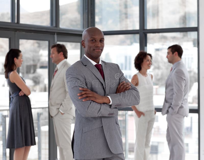 A Serious Business Man in Front of Business Team Stock Image - Image of ...