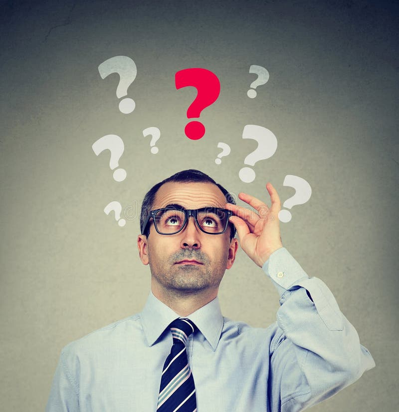 Serious Business Man Looking Up at a Key Question Stock Image - Image ...