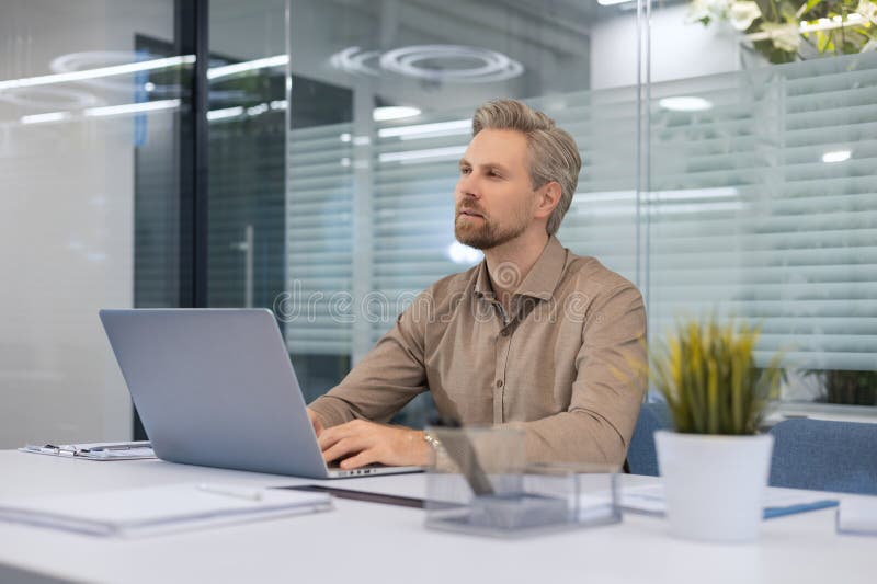 Serious Business Man Working on Documents Looking Concentrated with ...