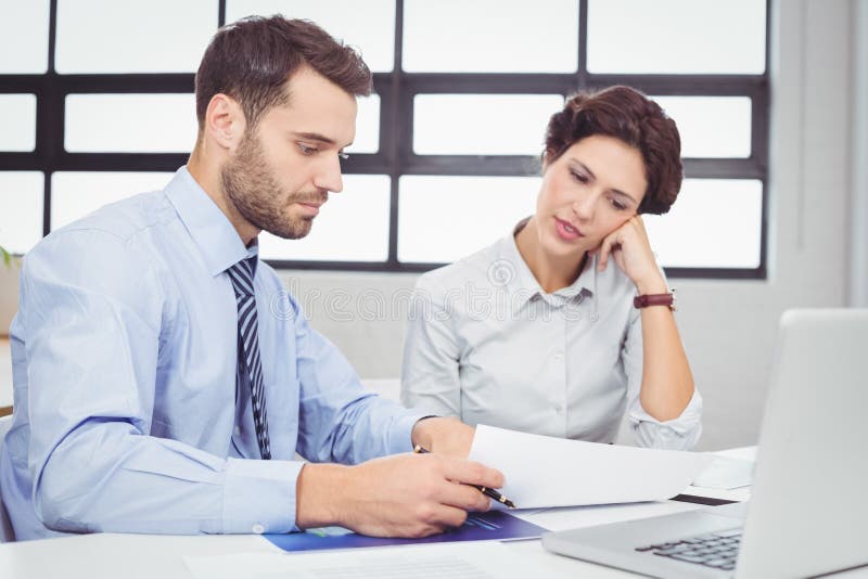 Serious Business People Working with Documents in Office Stock Photo ...