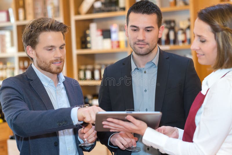 Serious Business People Working on Tablet in Office Stock Photo - Image ...