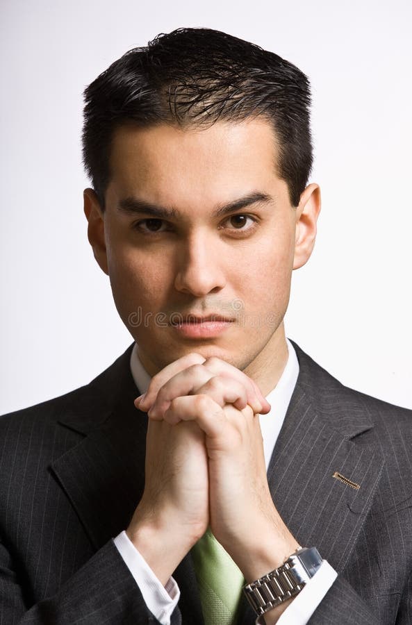 Serious Businessman with Hands Clasped Stock Photo - Image of looking ...