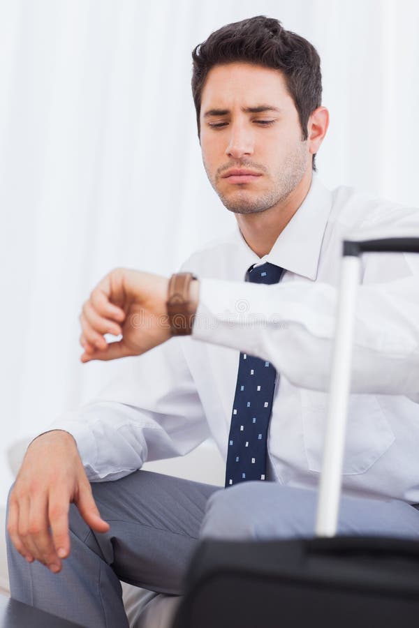 Serious Businessman with His Baggage Waiting for a Flight Stock Photo ...