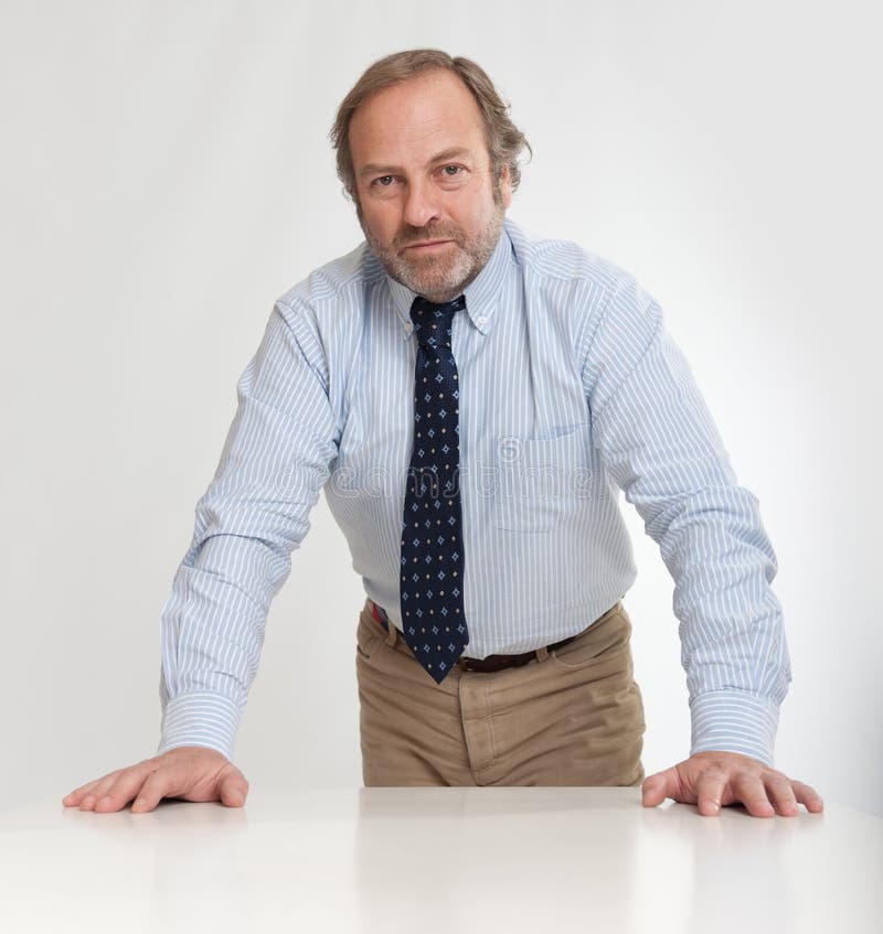 Serious Businessman Leaning on a Table Stock Photo - Image of manager ...