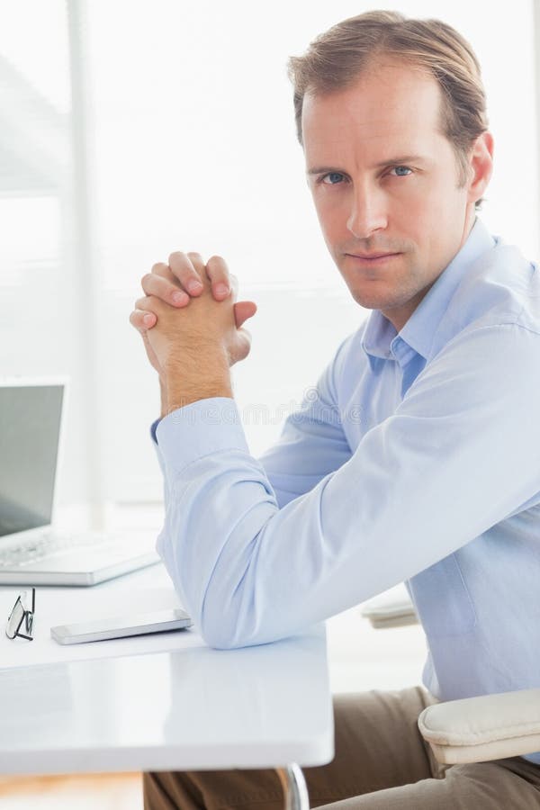 Serious Businessman Looking at Camera at Desk Stock Image - Image of ...