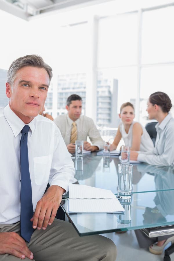 Serious Business People Looking at Camera during a Meeting Stock Photo ...