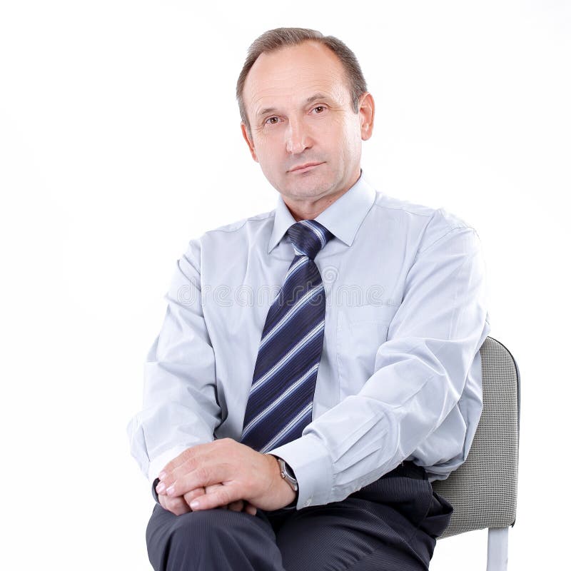 Serious Businessman Sitting in an Office Chair. Isolated on a White ... Serious Businessman Sitting in an Office Chair. Isolated on a White ...