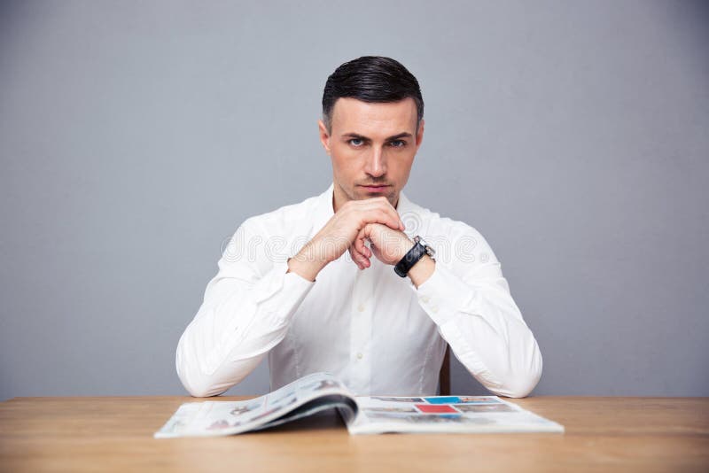 Serious Businessman Sitting at the Table Stock Image - Image of male ...