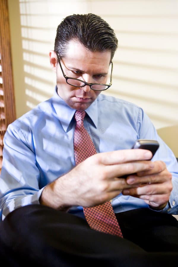 Serious Businessman Texting on Mobile Phone Stock Image - Image of ...