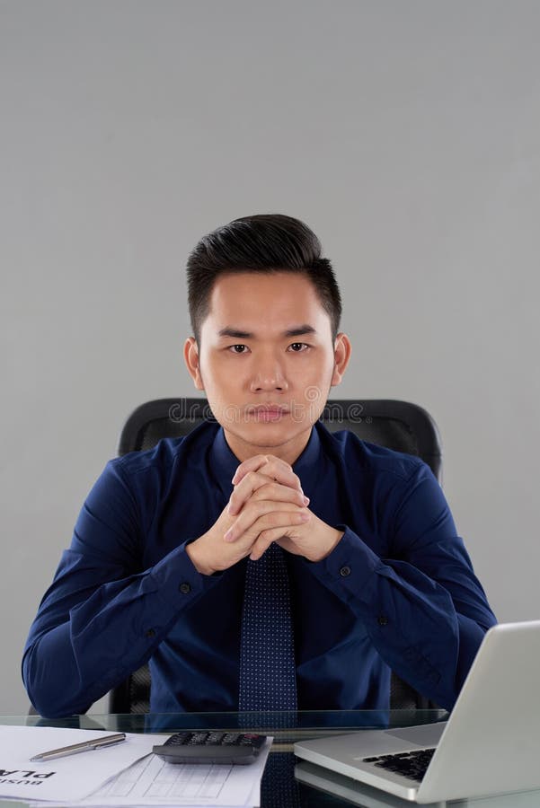 Unsmiling Asian woman stock photo. Image of attractive - 56923332