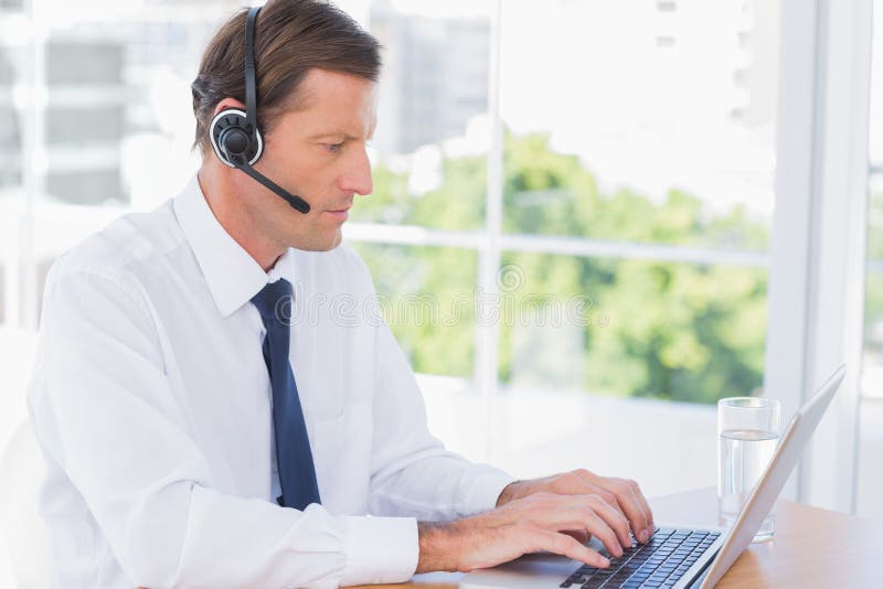 Serious Businessman Wearing a Headset Stock Image - Image of service ...