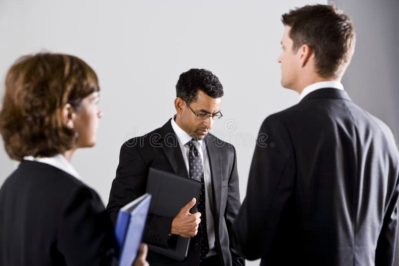 Serious Businesspeople, Standing, Looking Down Stock Photo - Image of ...