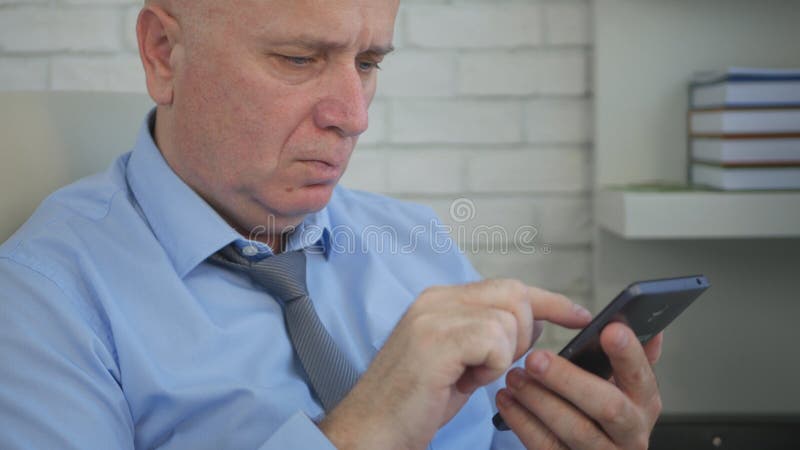Serious Businessperson in Office Room Text Using Cell Phone Stock Photo ...