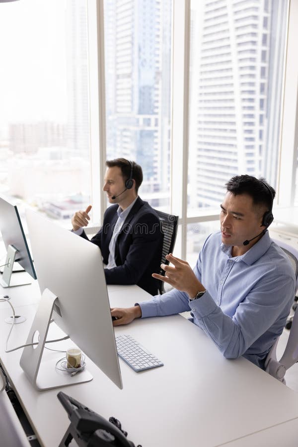 Serious Busy Asian Telemarketing Agent Man Talking To Client Stock ...