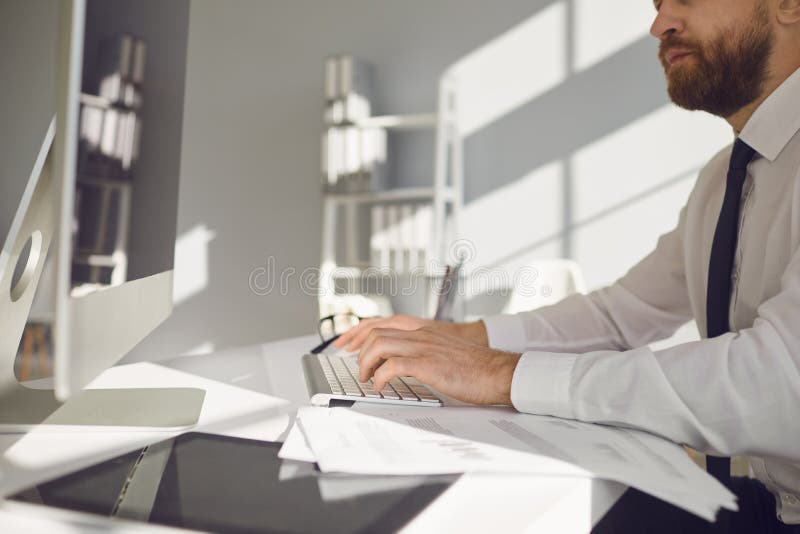 Work Online. Serious Busy Businessman Reads Working Documents Sitting ...