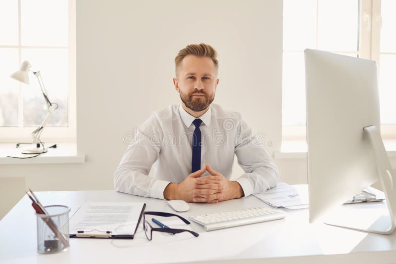 Serious Busy Businessman Working Sitting at a Table with a Computer in ...