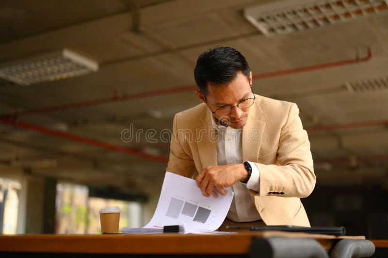 Serious Busy Professional Business Man Checking Document at an Office ...