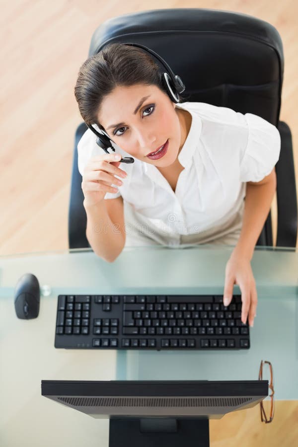 Serious Call Center Agent Looking at Camera while on a Call Stock Photo ...