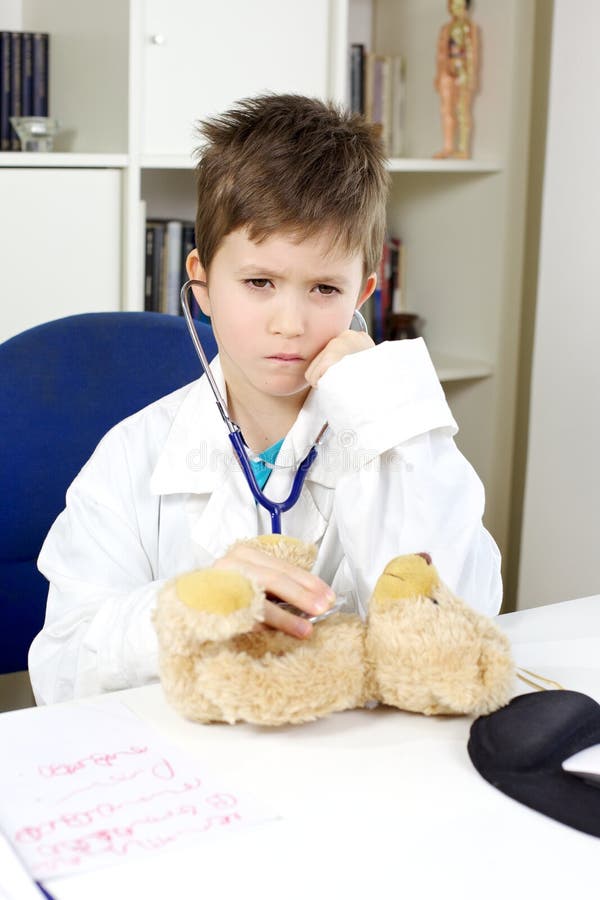 Serious Child Doctor at Work with Bear Plush Stock Image - Image of ...