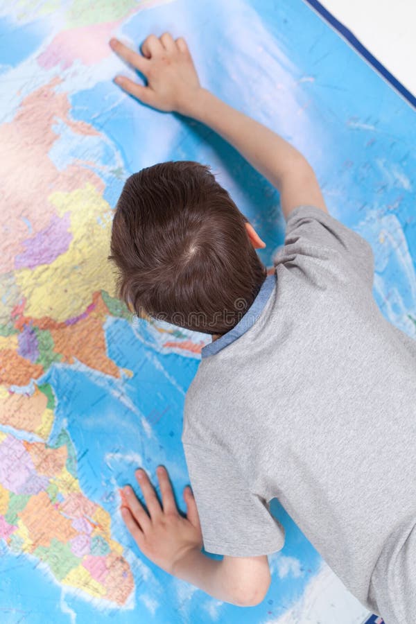 Serious Child Studying Map World Stock Photos - Free & Royalty-Free ...
