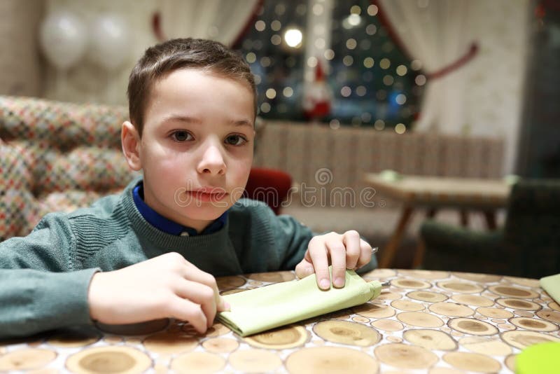 Serious Child at Table in Restaurant Stock Image - Image of handsome ...