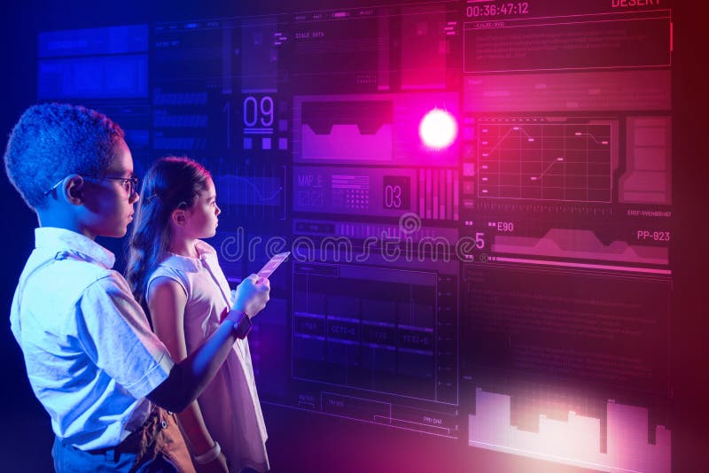 Serious Children Looking at the Screen while Testing Their New Computer ...