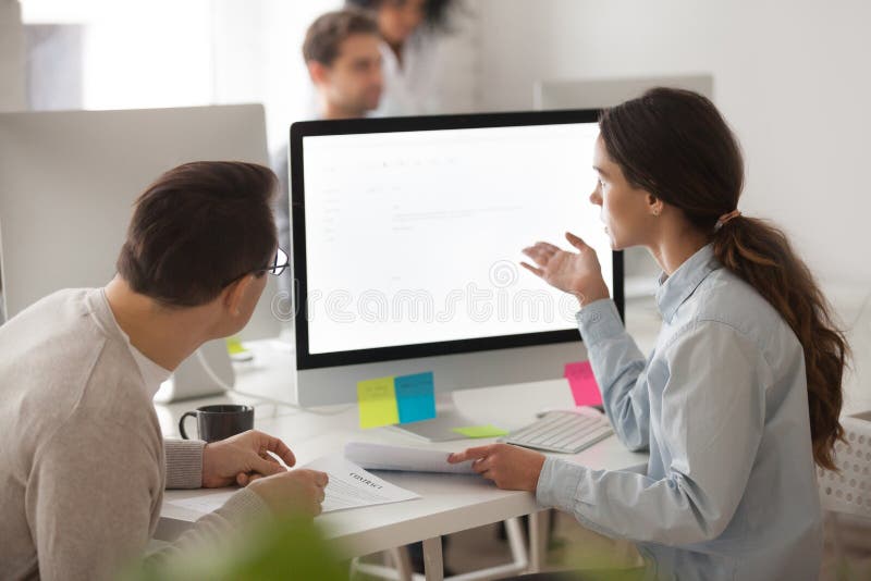 Serious Colleagues Discussing Email Preparing Contract for Clien Stock ...