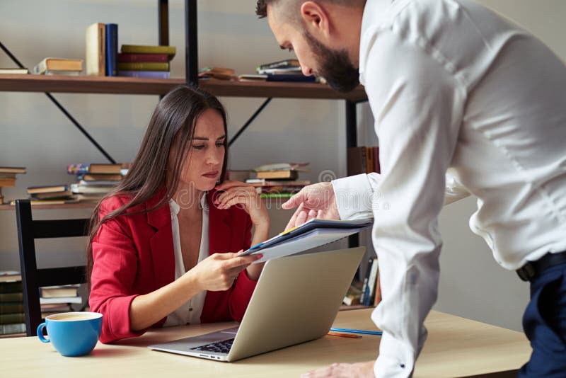 Serious Colleagues Discussion and Looking at Documents Stock Photo ...