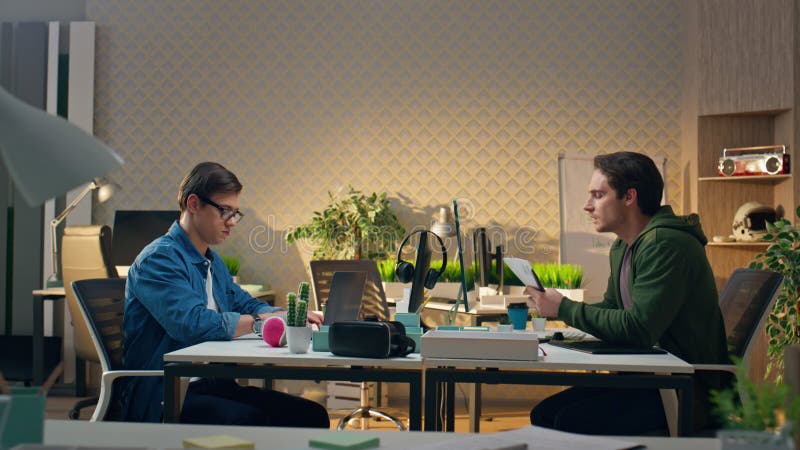 Serious Colleagues Using Computers Workplace. Busy Creators Working at ...