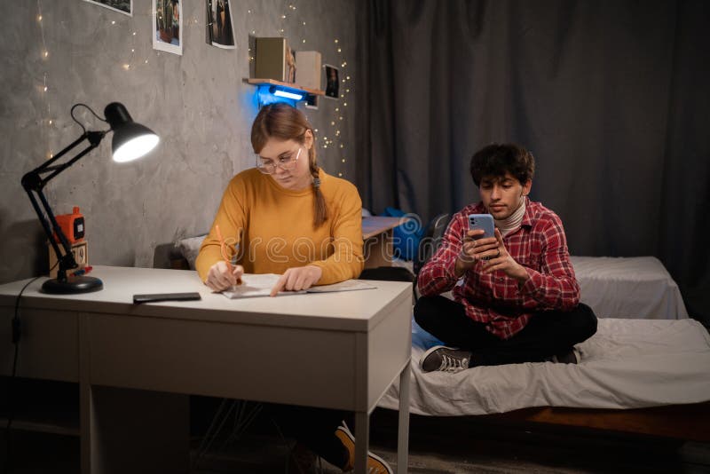 Serious College Students Studying in Dormitory at Night. Stock Photo ...