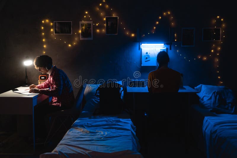 Serious College Students Studying in Dormitory at Night. Stock Image ...