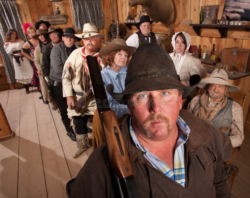 Serious Cowboy with Rifle in Saloon Stock Image - Image of saloon ...