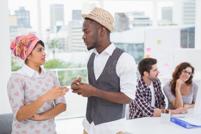 Serious Coworkers Standing and Interacting Stock Image - Image of ...