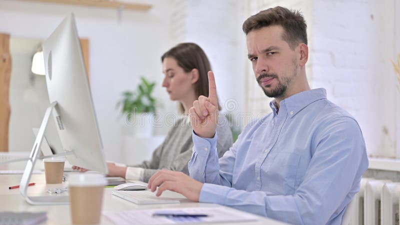 Creative Man Saying No with Finger Sign at Work Stock Image - Image of ...