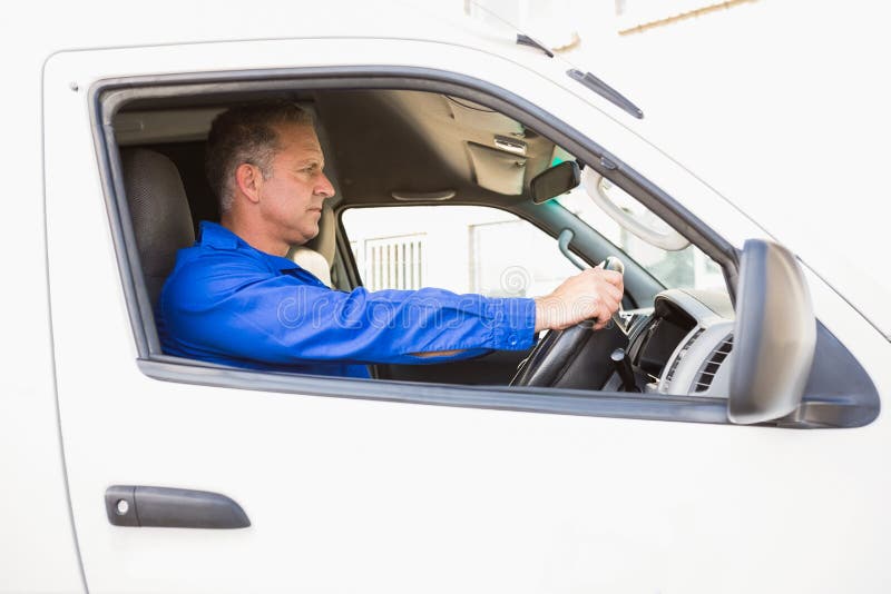 Serious Delivery Man Driving His Van Stock Photo - Image of courier ...