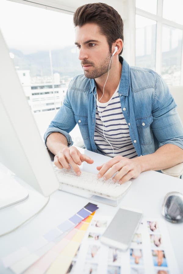Serious Designer Enjoying Music and Typing on Keyboard Stock Image ...