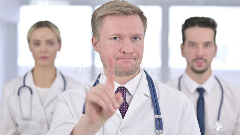 Serious Doctors Saying No by Hand Gesture Stock Photo - Image of ...