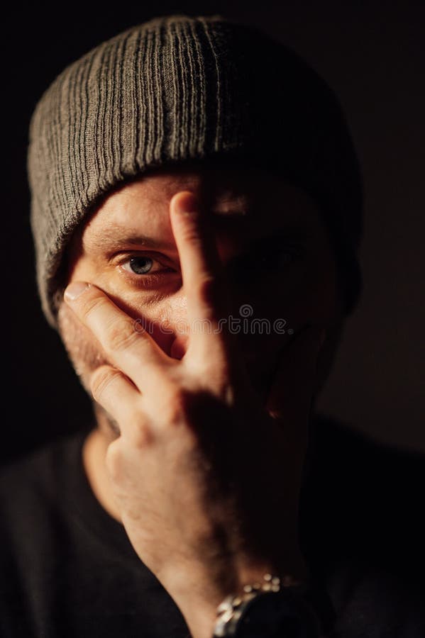 Serious Dramatic Man Looking Away while Standing Against Black Studio ...