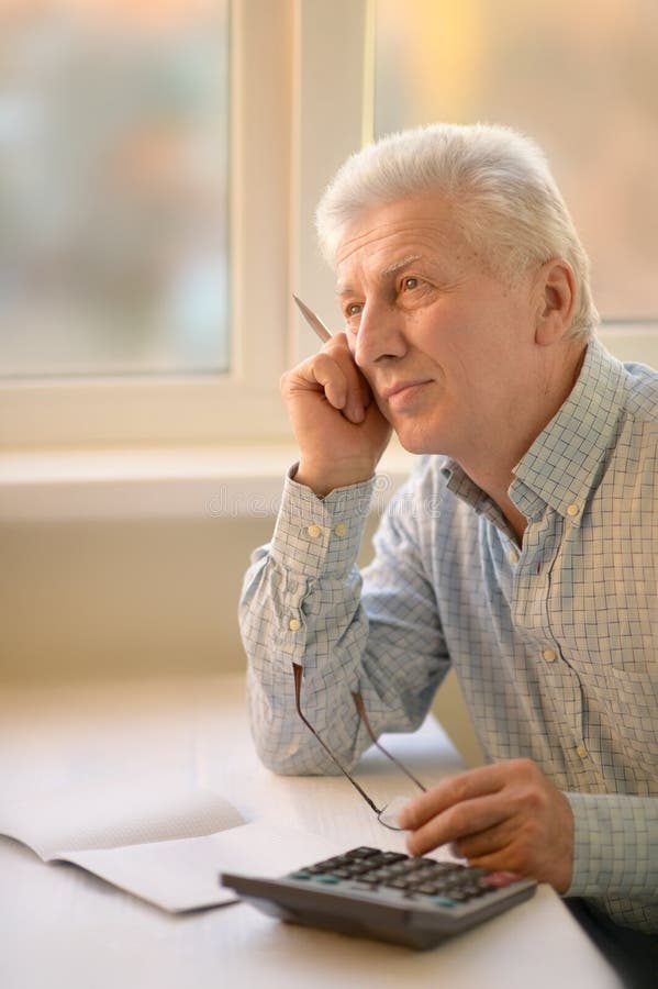 Serious Elderly Man with Calculator Stock Photo - Image of converation ...