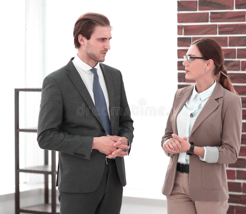 Serious Employees Talk Standing in the Office Stock Image - Image of ...
