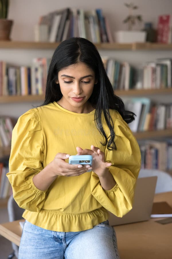Serious Engaged Young Indian Student Woman Typing on Smartphone Stock ...
