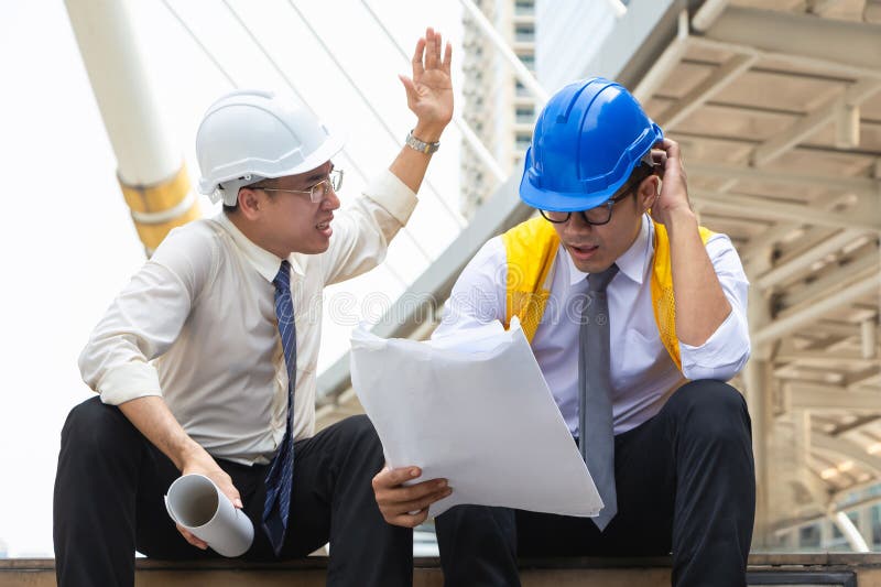Serious Engineer Man Team with Drawing Paper Planning Projects in ...