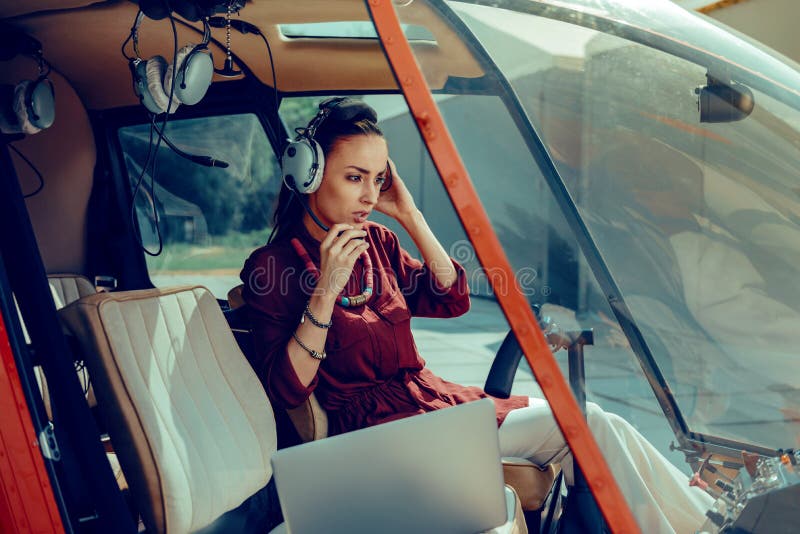 Serious Experienced Female Pilot Having Connection with Flight Operator ...