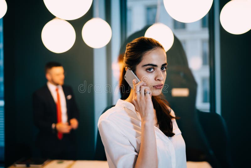 Focused Businesswoman Chatting on Phone Stock Image - Image of table ...