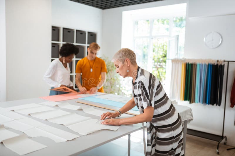 Serious Female Fashion Designer Working on a Pattern Stock Image ...