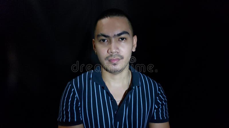A Serious Filipino Man Staring Stock Footage - Video of reticent ...