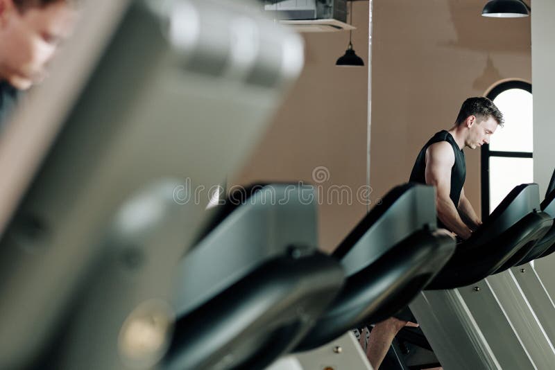 Man running on threadmill stock image. Image of women - 171942039
