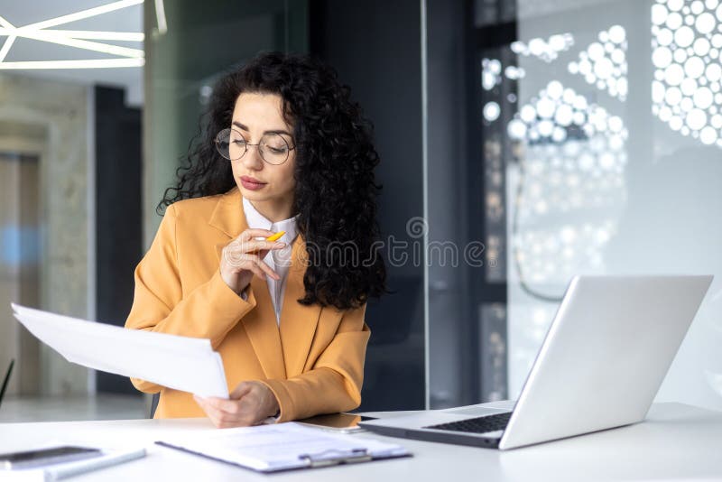 Serious Focused Female Financier Working Inside Office with Documents ...
