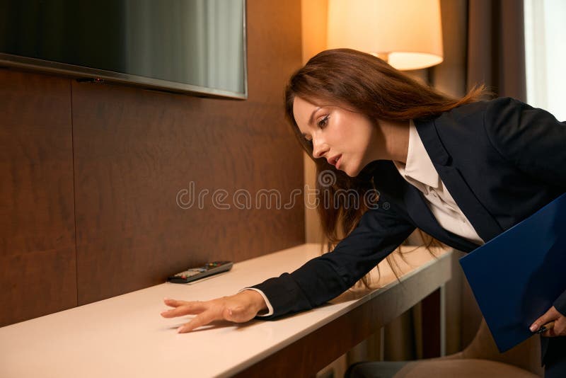 Manager Checking Tabletop for Cleanliness during Hotel Room Inspection ...