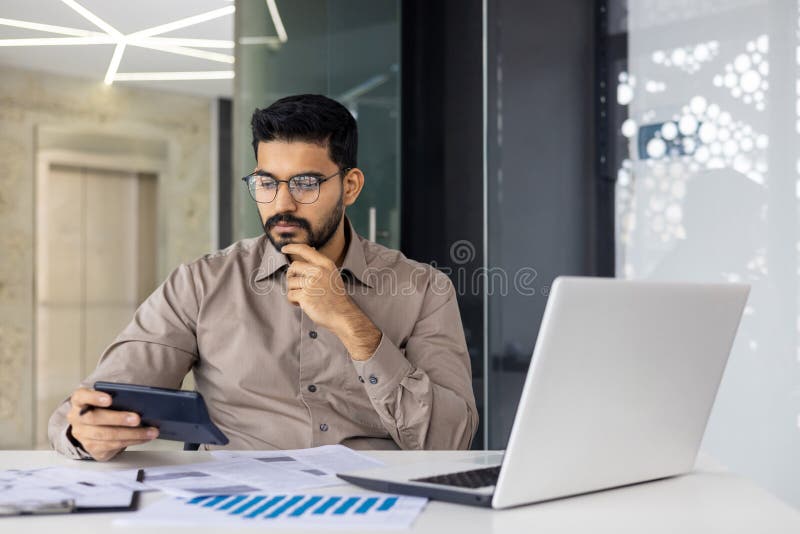 Serious and Focused Young Indian Male Accountant and Expert Working in ...